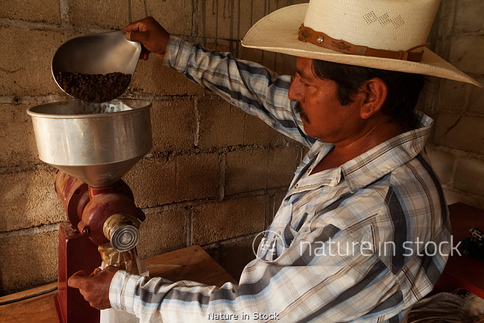 Man Grinding Coffee